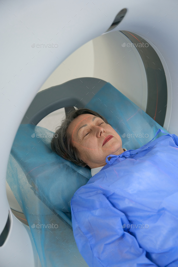 Elderly woman is placed in the camera of MRI machine Stock Photo by ...