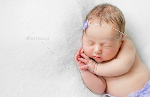 lovely newborn girl sleeping with hands under head, top view Stock ...