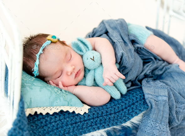 newborn baby girl sleeping in a little bed Stock Photo by tan4ikk | PhotoDune