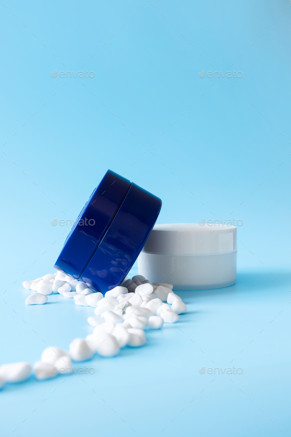 Blue and white moisturizer cream jars and small minerals Stock Photo by ...