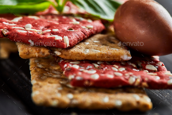 Beetroot and rye flour crackers with vegetables for making snacks on a ...
