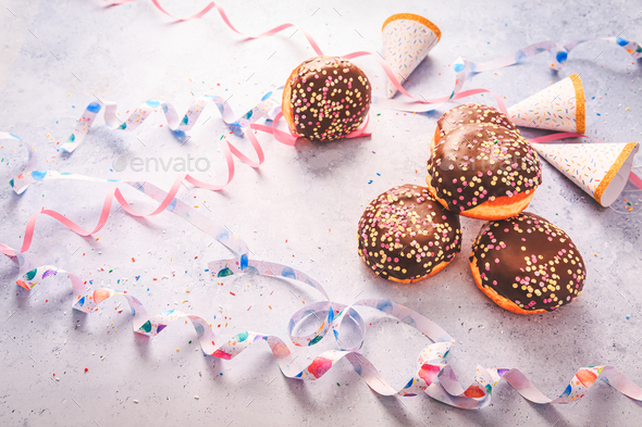 Chocolate Berliner pastry for carnival and party. German Krapfen or ...