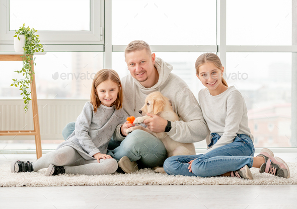 Happy family and puppy Stock Photo by tan4ikk | PhotoDune
