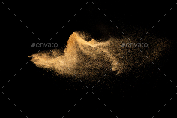 Dry river sand explosion.Brown color sand splash against black ...