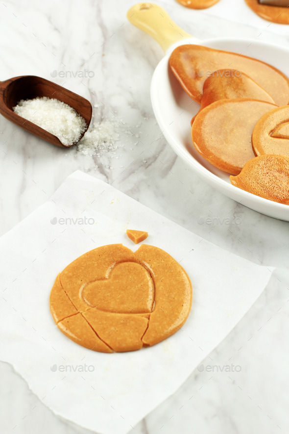 Heart Shape Stamped Candy Dalgona Ppopgi Isolated on White, Playing ...