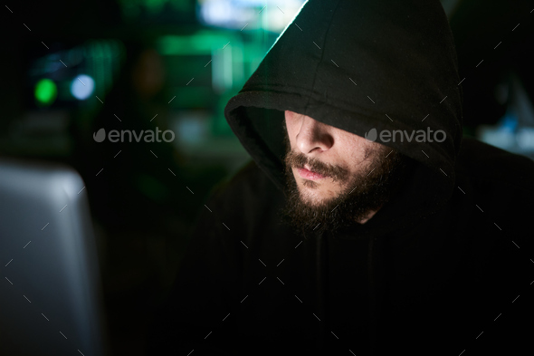 Criminal team Hacker using computer for organizing massive data breach ...