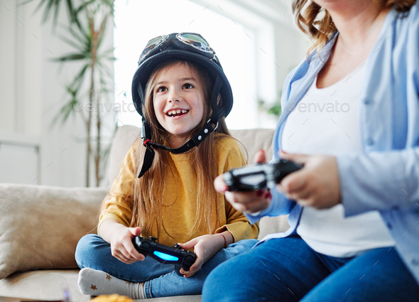child daughter mother family happy playing console kid childhood Stock ...