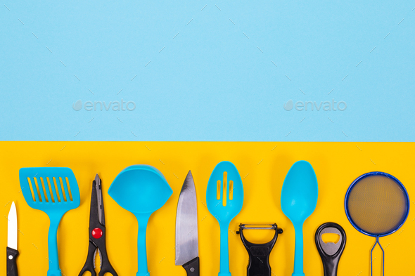 Design concept of kitchen utensils isolated with copyspace on blue ...