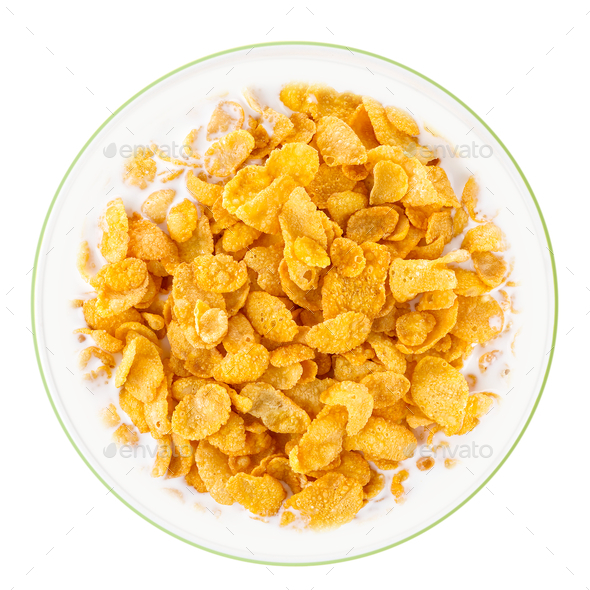 Bowl of sweet cornflakes with milk isolated on white background, top ...