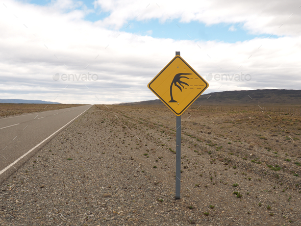 Road sign warning of strong wind in a roadside of desert Stock Photo by ...