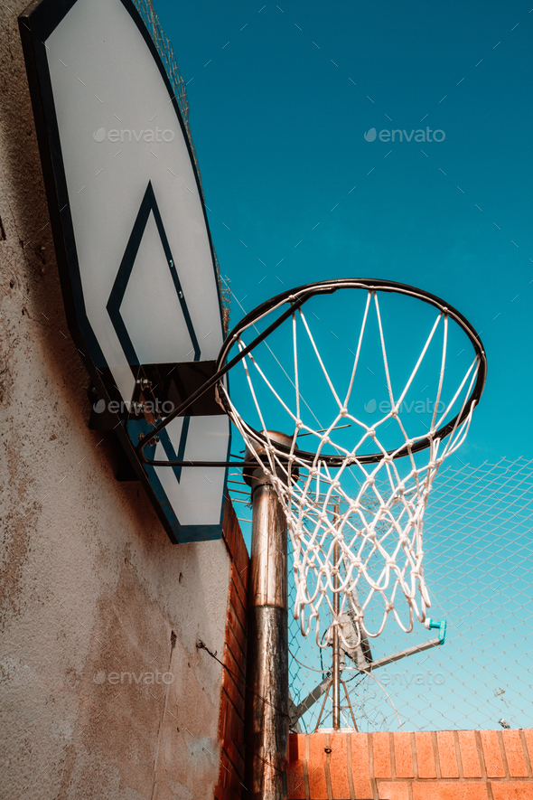 Vertical low angle shot of basketball hoop Stock Photo by wirestock