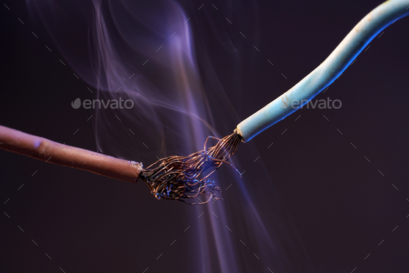 Electric arc, a closeup shot of electrical wires Stock Photo by wirestock