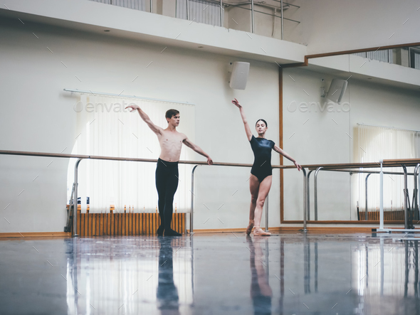 Man practicing in ballet with partner ballerina woman in black clothing ...