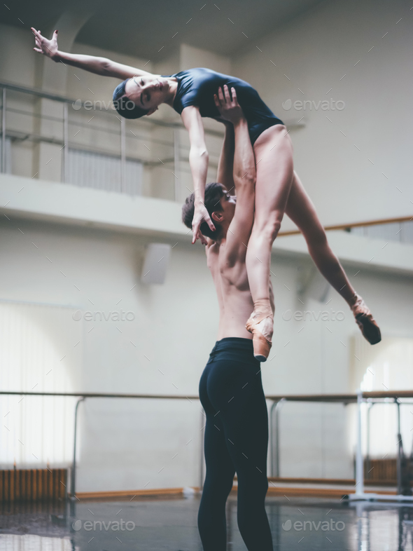Man practicing in ballet with partner ballerina woman in black clothing ...