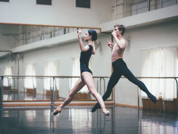 Man practicing in ballet with partner ballerina woman in black clothing ...