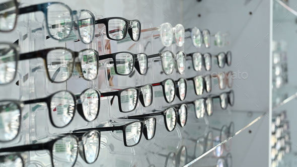 Image of spectacles on shelf in optical store. Optics, health care and ...
