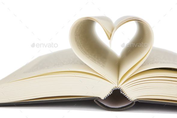 Open book with heart shaped pages. Love for reading Stock Photo by ABBPhoto