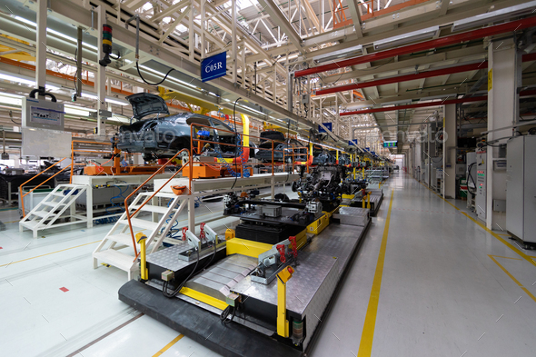 Transfer of car body. Robotic equipment makes Assembly of tcar. Modern ...