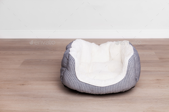 Grey and white empty textile basket bed for dog or cat Stock Photo by ...