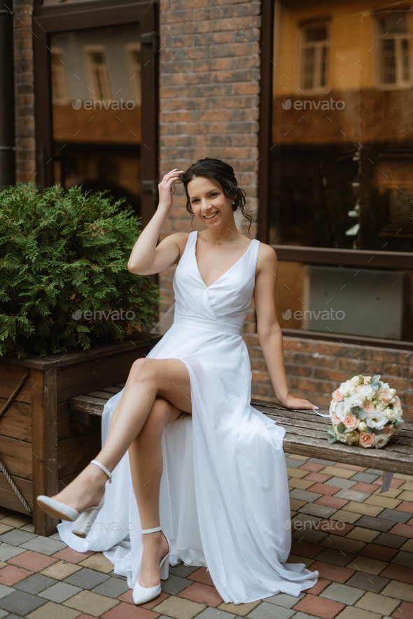 preparations for the bride with the dressing of the wedding dress Stock ...