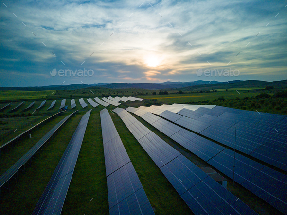 Solar panels to generate energy from the sun's rays are under a blue ...