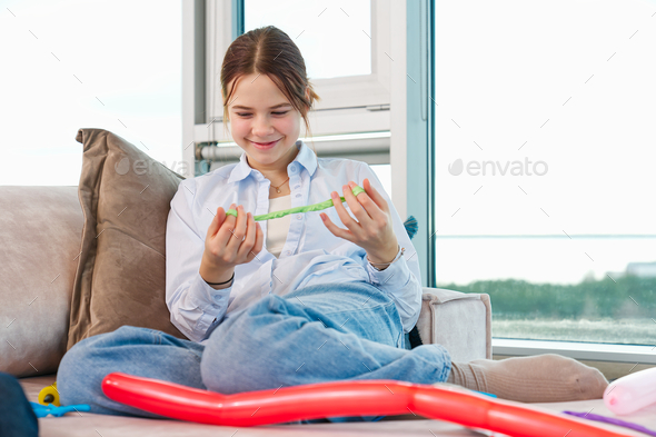 Children inflate modelling balloons. kids having fun with balloons ...