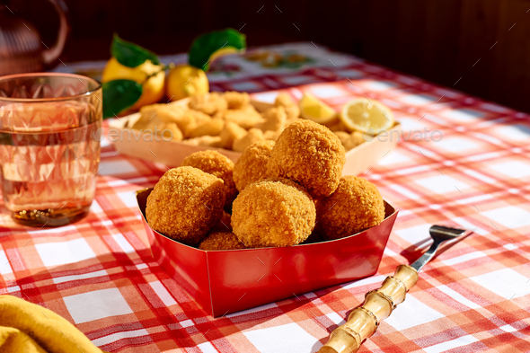 Typical Sicilian street food arancini (deep fried rice balls with meat ...