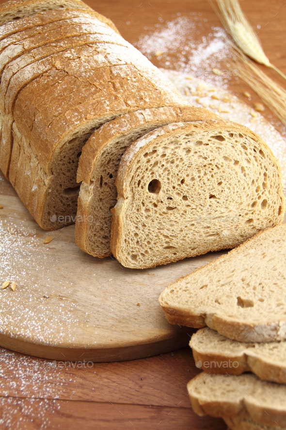 Loaf of fresh sliced bread Stock Photo by rawf8 | PhotoDune