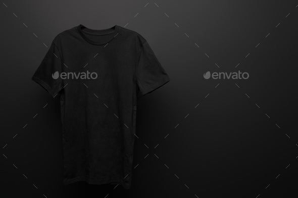 blank basic black t-shirt on black background Stock Photo by ...