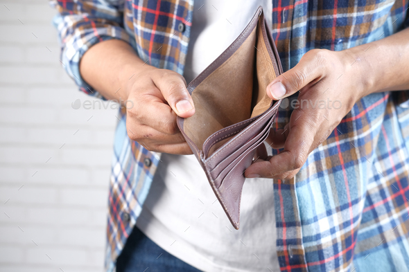 Man hand open an empty wallet with copy space. Stock Photo by towfiqu98