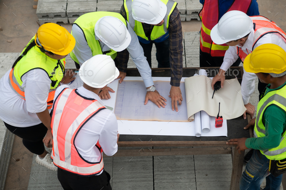 Construction engineers, architects, and foremen form a group ...