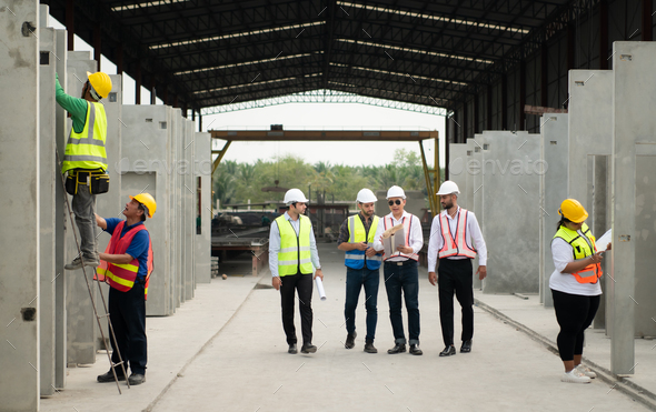 Architects a visit to the construction site. Stock Photo by wosunan
