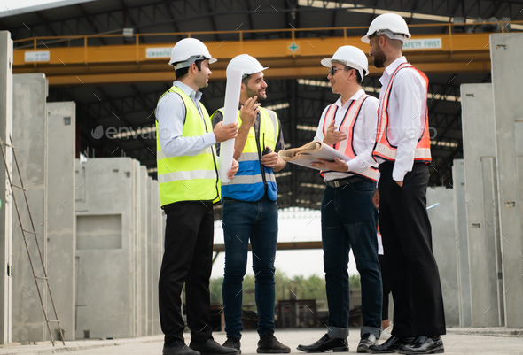 Architects a visit to the construction site. Stock Photo by wosunan