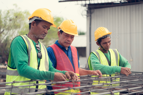 Construction worker is tying the structural steel firmly Stock Photo by ...