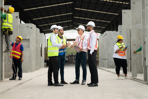 Architects a visit to the construction site. Stock Photo by wosunan