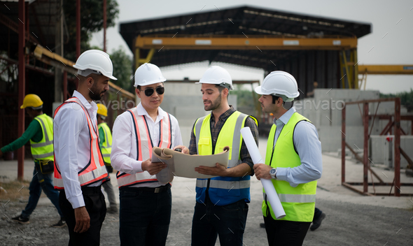 Architects a visit to the construction site. Stock Photo by wosunan