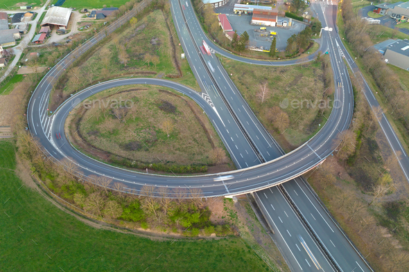 Aerial view of highway road intersection with fast moving heavy traffic ...