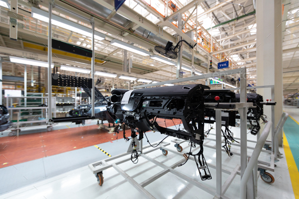 Add details to car body. Robotic equipment makes Assembly of car ...