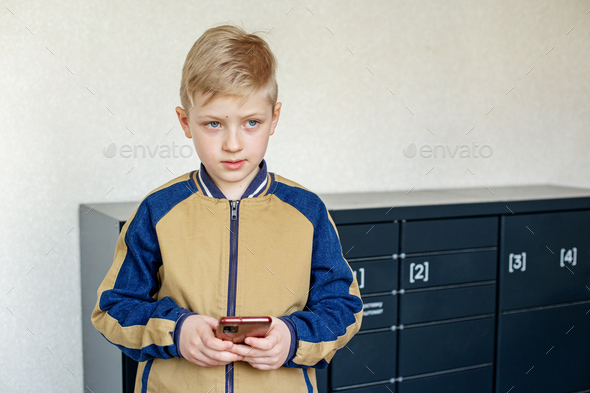 Boy client using automated self service post terminal machine or locker ...