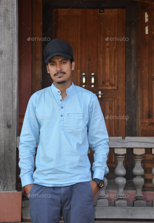 Front view of a north Indian young guy wearing cap backwards and posing ...