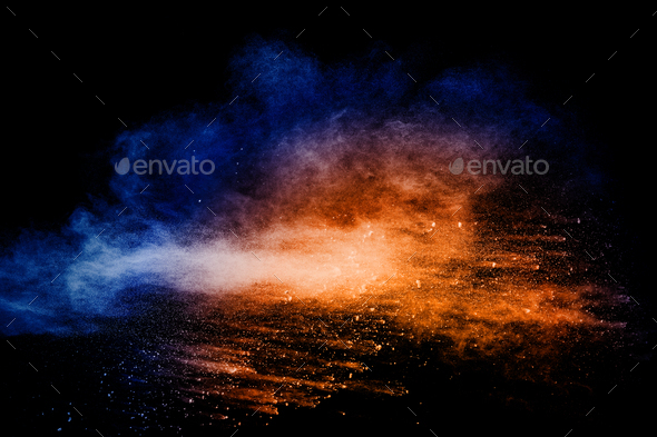 Orange blue powder explosion on black background.Orange blue color dust ...