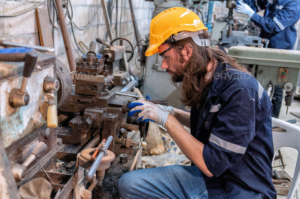 In robotic maintenance repair engineer lathe machine fabricate part and ...