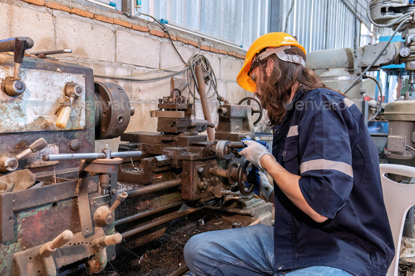 In robotic maintenance repair engineer lathe machine fabricate part and ...