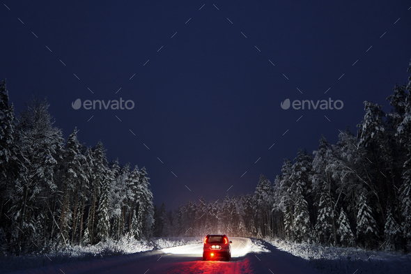 Road trip picture of the winter road in the north territory at night ...