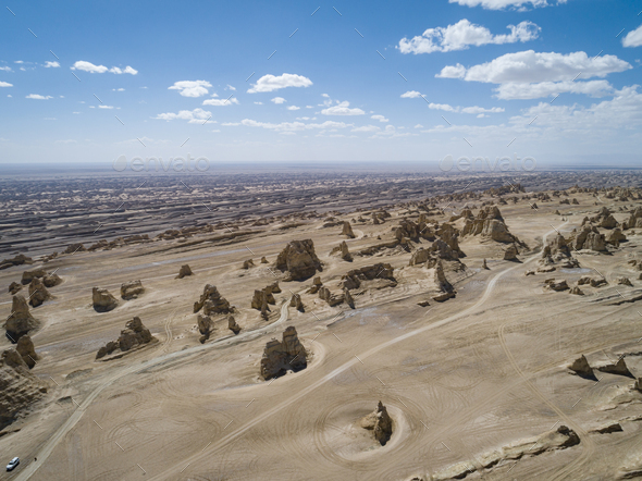 Aerial view of landscape in desert under blue sky Stock Photo by lzf