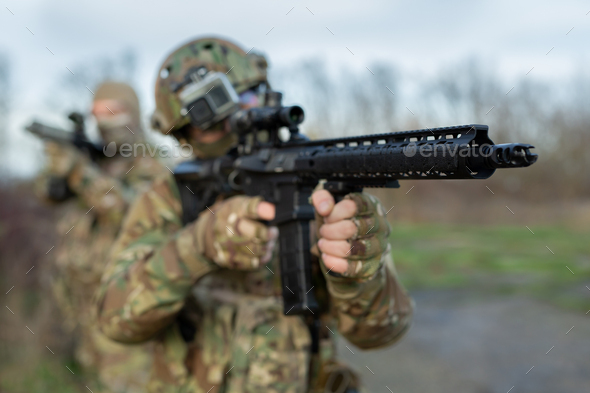 Two military man with airsoft automatic rifle. Stock Photo by StudioPeace