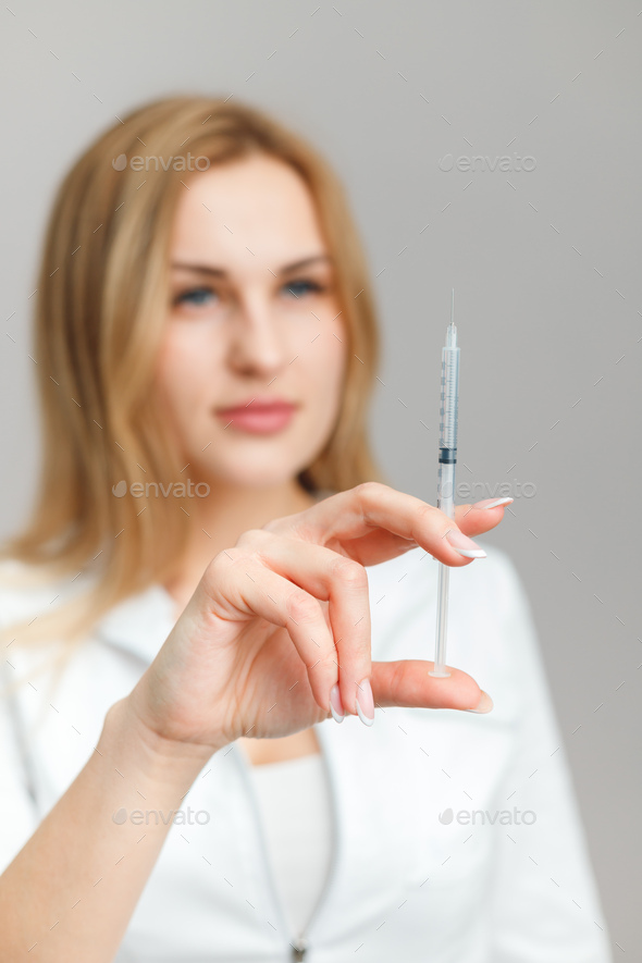 Syringe, medical injection in bare hand without glove. Nurse or doctor ...