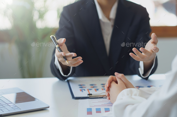 Close-up of a group of business meeting to discuss plan analyze graph ...