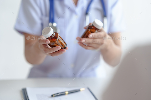 Doctor is explaining to the patient information about the use of the ...