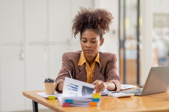 businesswoman analyzing statistics on laptop screen, working with ...